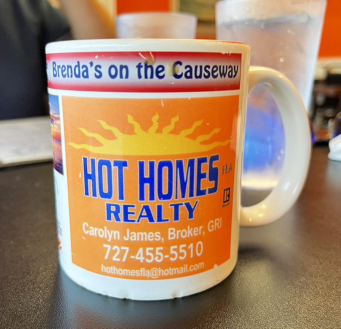 The mug says "Hot Homes Realty," but the coffee inside says "I'll make your morning worth facing." Local business supporting local business.