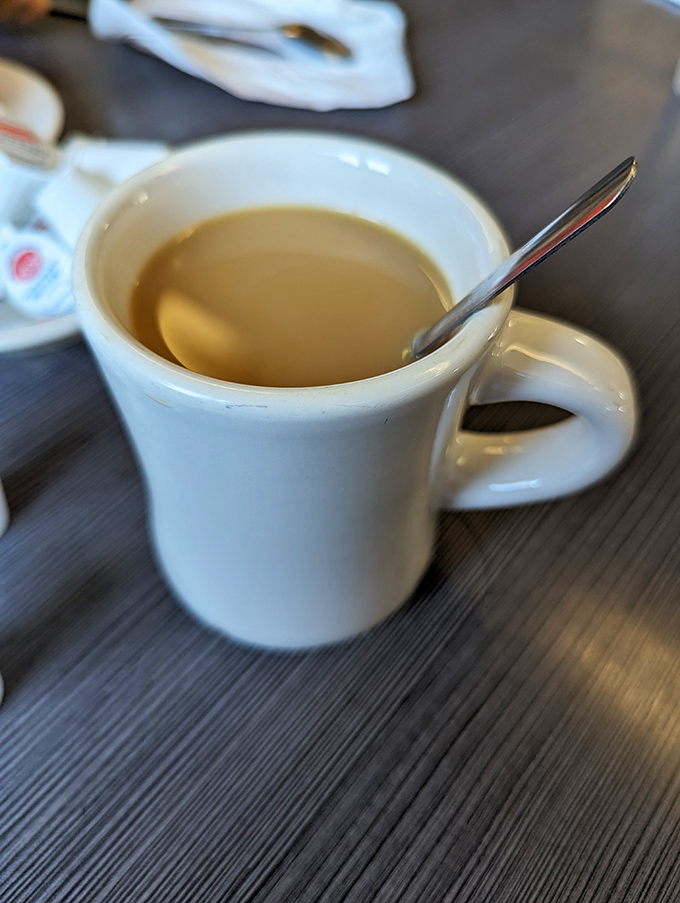 The humble diner mug—holding liquid ambition that fuels Massachusetts mornings and countless "just one more cup" decisions.