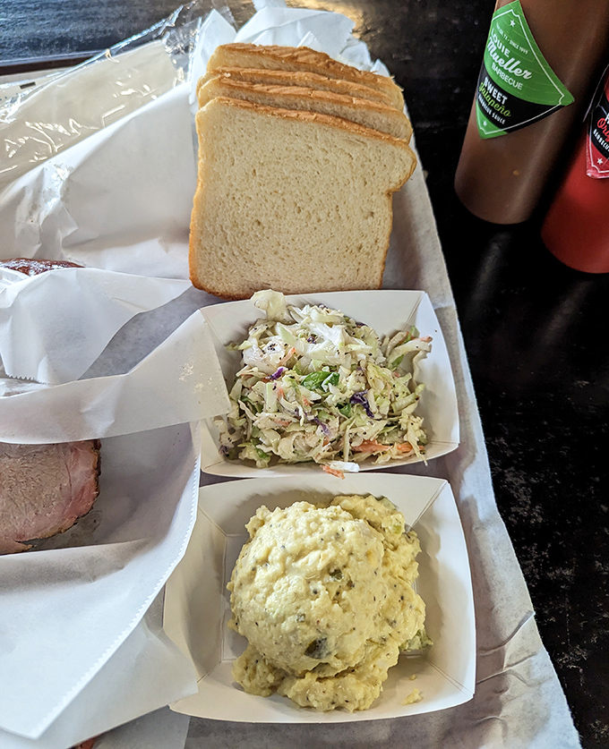 Coleslaw, potato salad, and bread form the supporting cast that knows exactly when to step in and help.