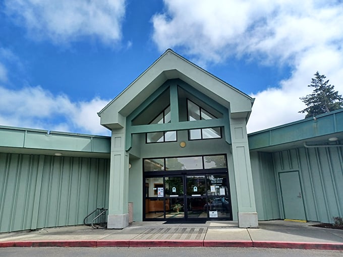 Not just books but a community gathering place. The Coos Bay Library's modern entrance welcomes knowledge-seekers of all ages.