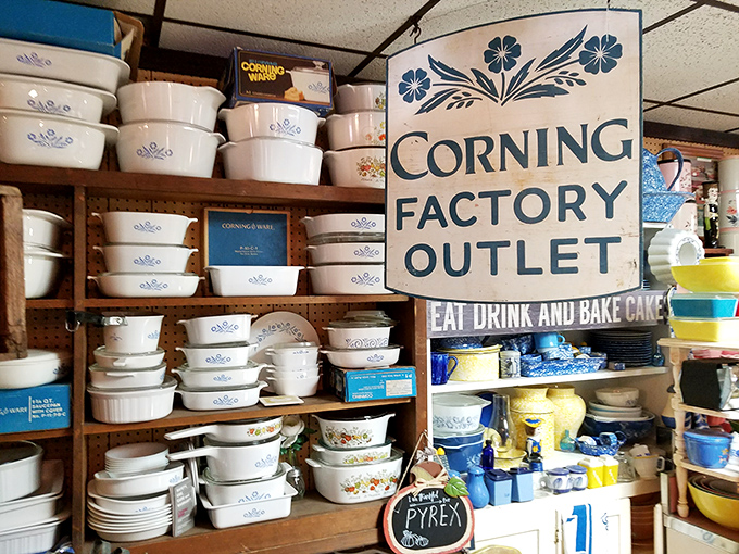 The Corning Factory Outlet sign presides over a kingdom of casserole dishes that have witnessed thousands of family dinners.