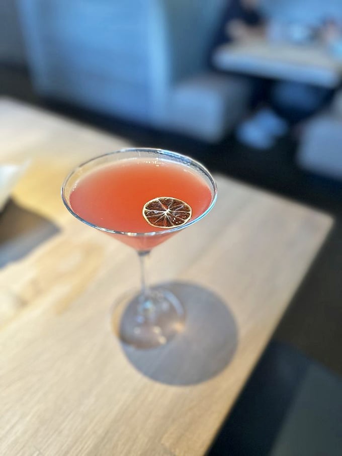 A blood orange martini that's as photogenic as it is delicious. The dried citrus garnish adds a sophisticated touch to this sunset-colored cocktail.