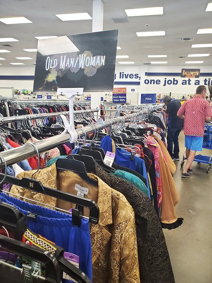 Beneath signs for "Old Man/Woman," vintage formal wear awaits its next gala, proving elegance never goes out of style—or budget.