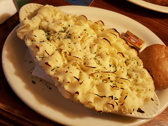 Cottage pie with a golden potato roof sheltering a savory treasure of meat and vegetables below.