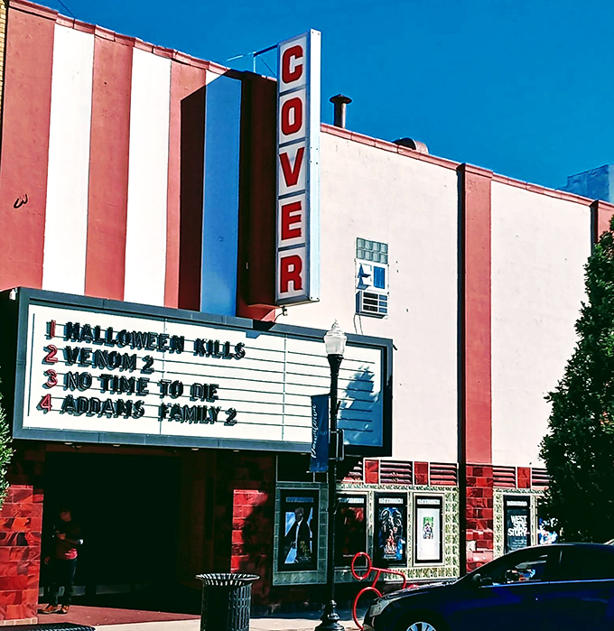 The Cover Theatre's vintage marquee transports you to an era when movie nights were events and popcorn didn't require a small loan.