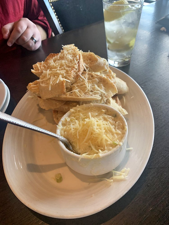 Cheesy, garlicky goodness served with crisp bread – the kind of appetizer that makes everyone at the table suddenly develop longer arms.