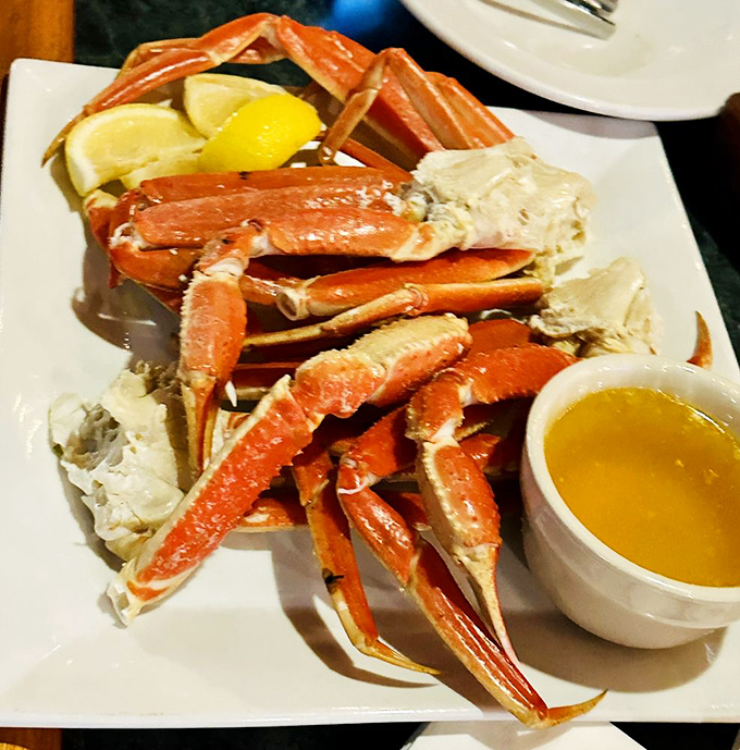 Snow crab legs arranged like a delicious puzzle waiting to be solved&mdash;the kind of hands-on seafood experience that justifies wearing the plastic bib without shame.