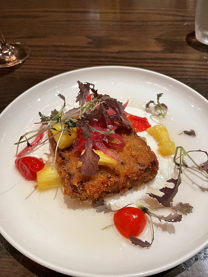 This crispy pork belly with colorful accompaniments is what happens when comfort food gets dressed up for a night out.