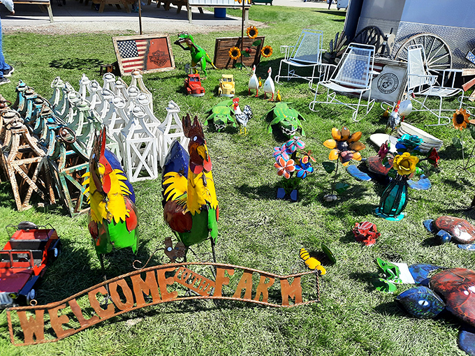 A whimsical menagerie of yard art featuring metal roosters, garden flags, and cheerful decorations that practically beg to brighten up your flower beds.