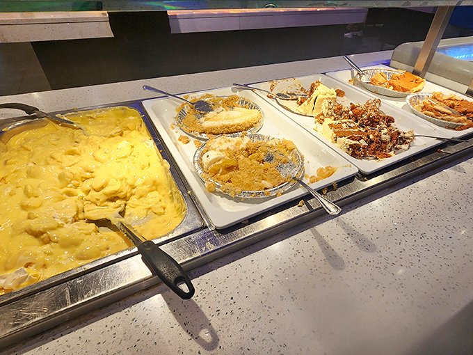 The mac and cheese glows with an almost radioactive promise of comfort, while pie waits patiently for your inevitable surrender.