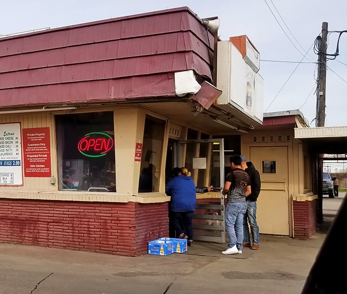 The walk-up window where patience is rewarded with paper-wrapped perfection. Good things come to those who wait.