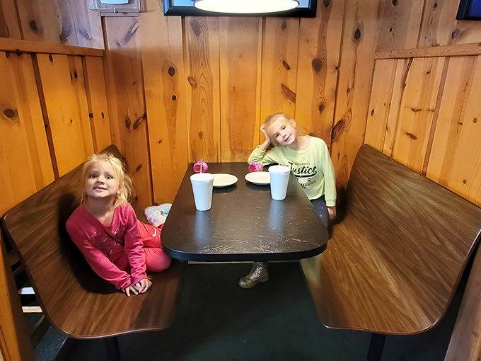 Family memories in the making! These cozy booths have witnessed countless birthday celebrations, team victories, and "just because it's Tuesday" pizza nights.