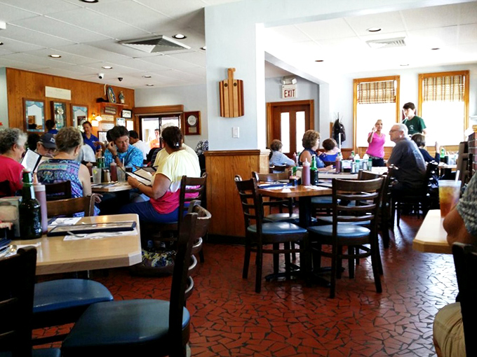 Every table filled with folks who drove past fancier places to get here instead.