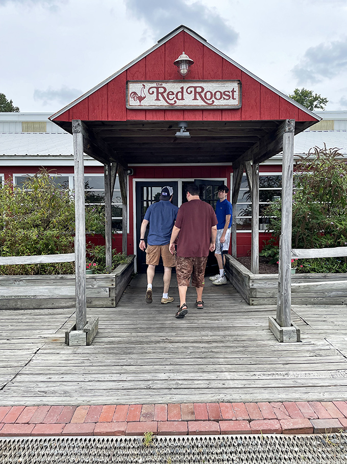 The pilgrimage begins as diners enter beneath the iconic Red Roost sign, anticipation building with each step toward seafood nirvana.