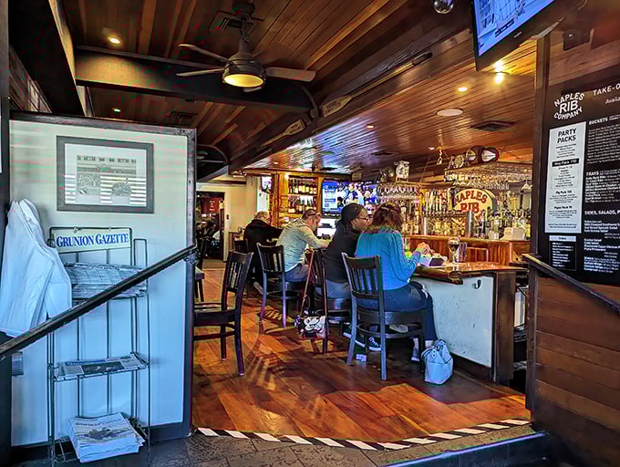 The bar area invites conversation among strangers who quickly become friends, united by their appreciation for serious barbecue.