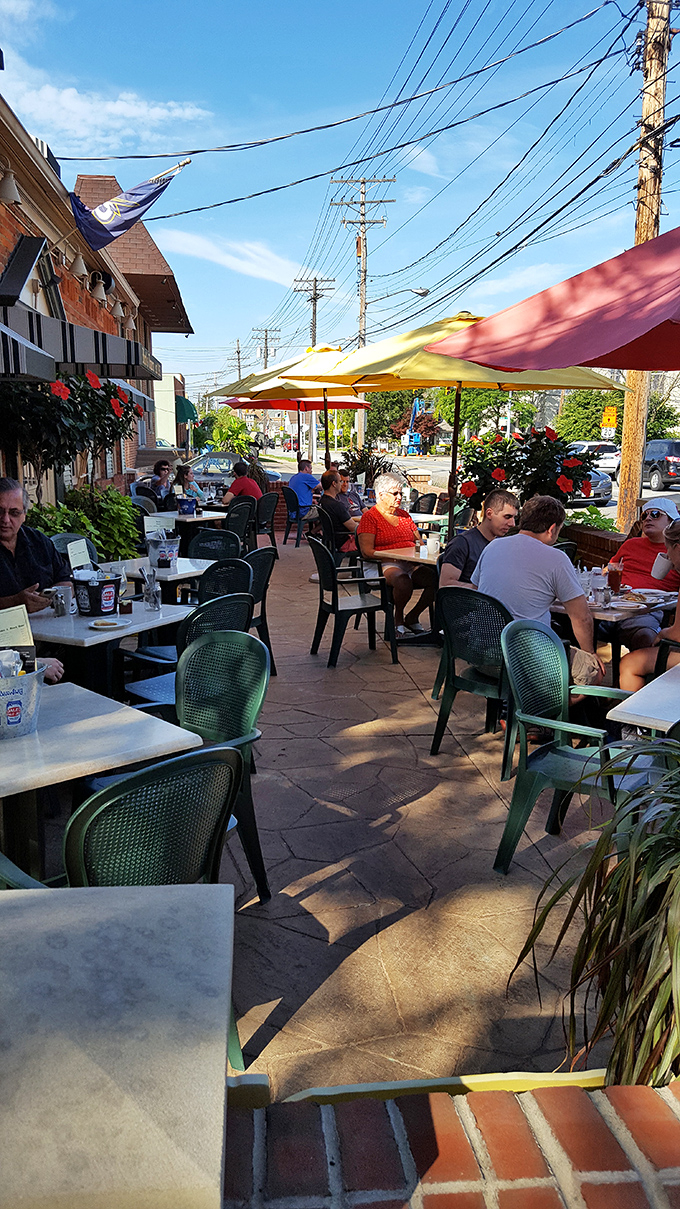 The patio at Herb's buzzes with the energy of people who've discovered that good food tastes even better under Ohio's summer sky.