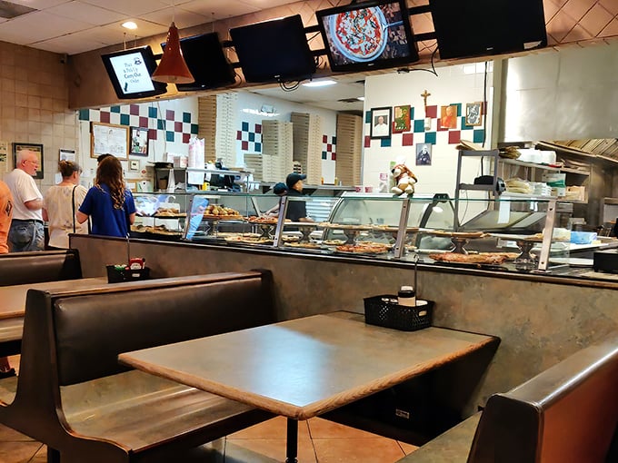 Where pizza magic happens. The display case is like a museum of edible art, except you're encouraged to take the exhibits home.