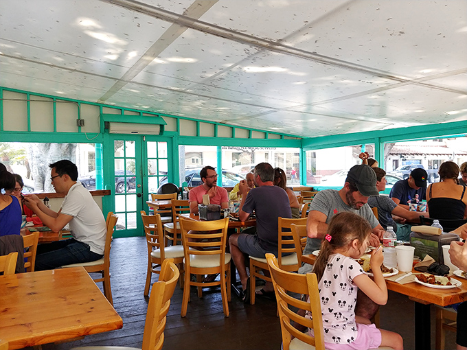 The universal language of taco appreciation brings together families, couples, and solo diners in this sun-drenched sanctuary of satisfaction.
