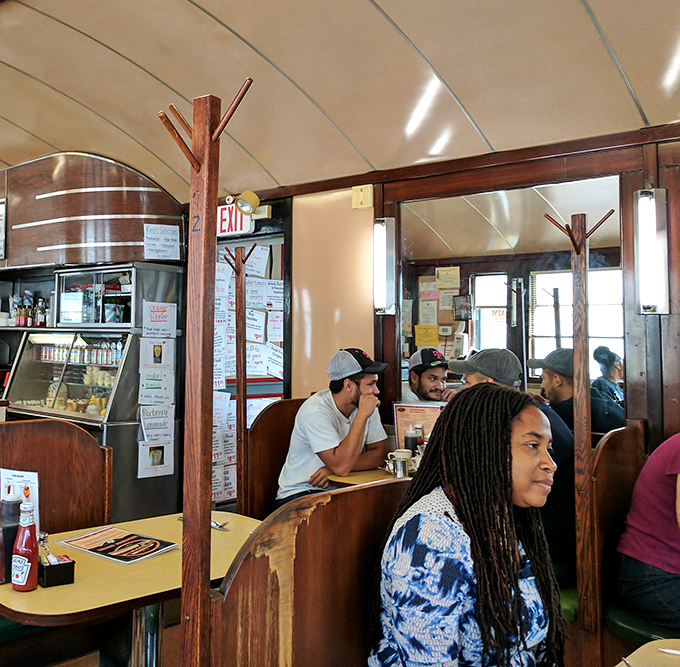The diner's booths offer front-row seats to the breakfast theater, where regulars and newcomers share the communal joy of morning rituals.