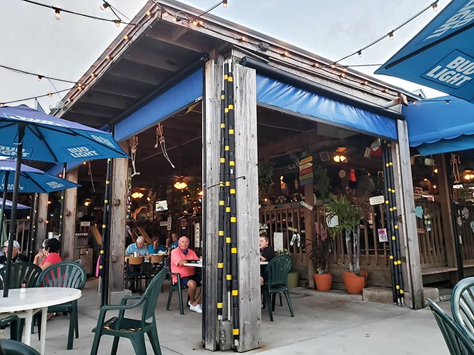 The covered outdoor seating area provides shelter from the Florida sun while still letting you soak in those million-dollar marina views.