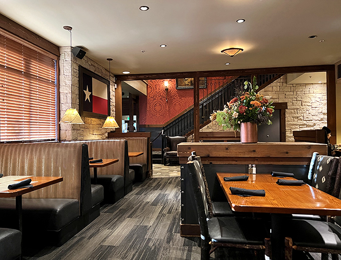 Texas pride shines through every detail of the dining room, from the lone star flag to the warm stone walls that whisper "y'all stay awhile."