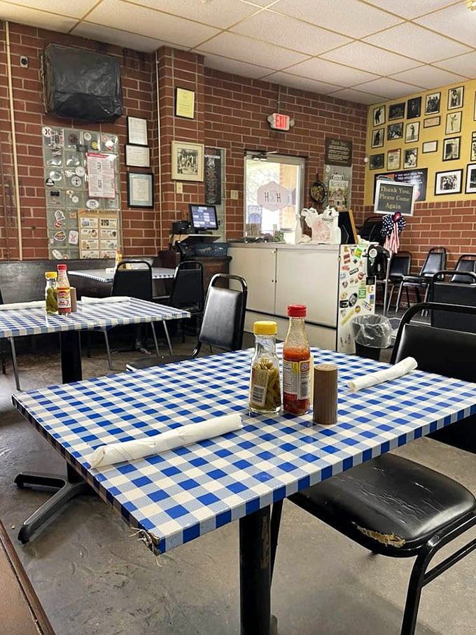 Every table tells a story at H&H, where blue checkered cloths and condiment bottles stand ready for the next hungry visitor.