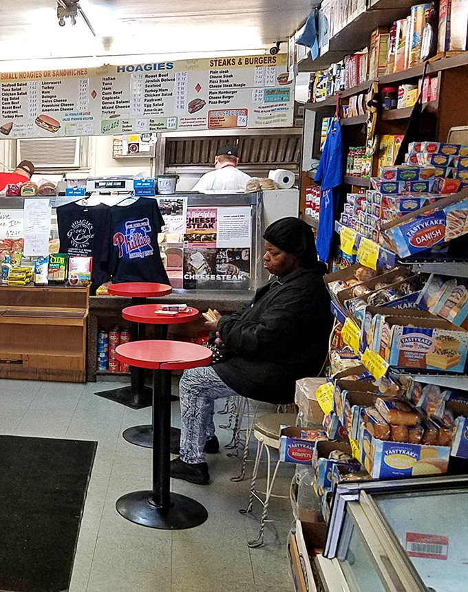 The red counter stools aren't just seating&mdash;they're front-row tickets to the sandwich-making symphony happening behind the counter.