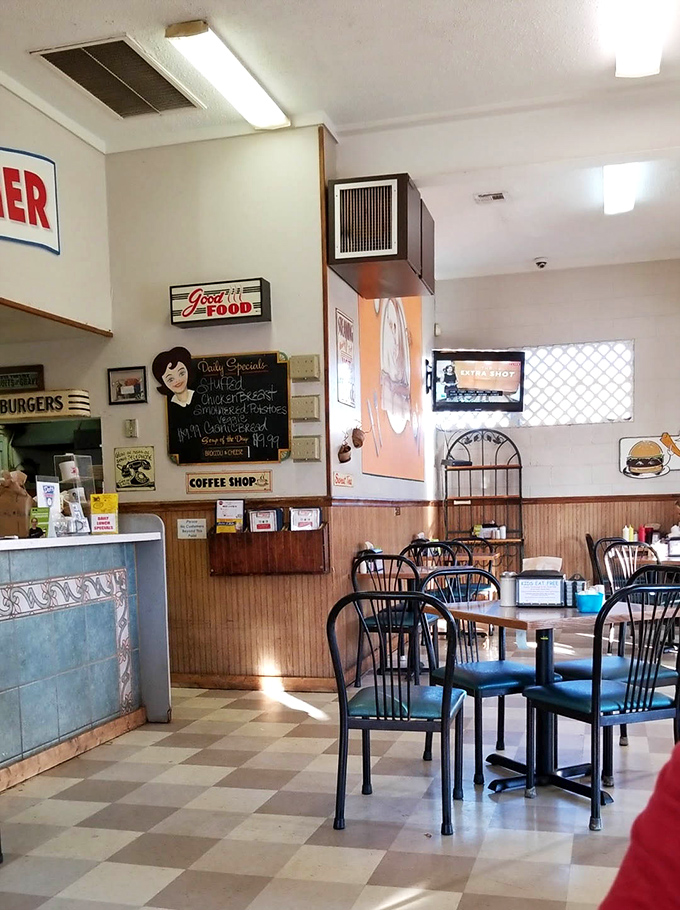 Checkerboard floors and simple furnishings create the stage where breakfast theater unfolds daily, no reservations or fancy attire required.