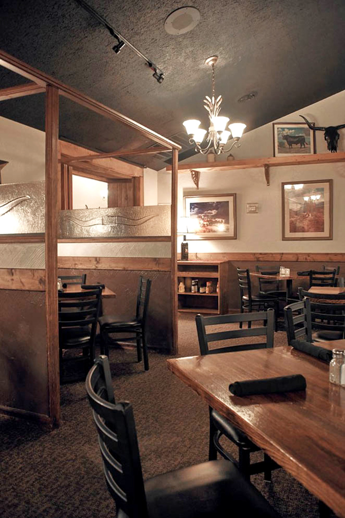 Semi-private booths offer the perfect balance between "we're all in this together" and "this steak moment is mine alone."
