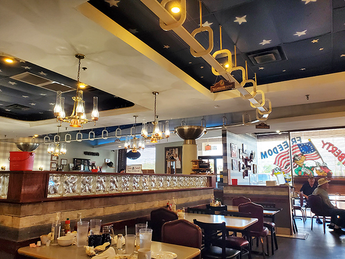 Chandeliers hanging from a star-studded ceiling &ndash; because even casual dining deserves a touch of whimsical elegance.