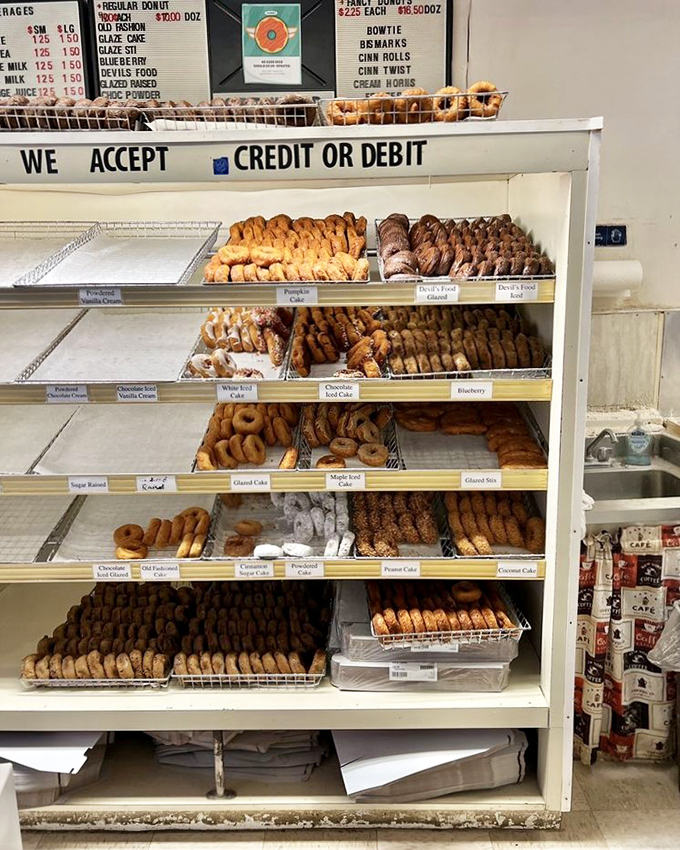 The display case at Donut World is like a museum of edible art, except you're encouraged to take the exhibits home and devour them.