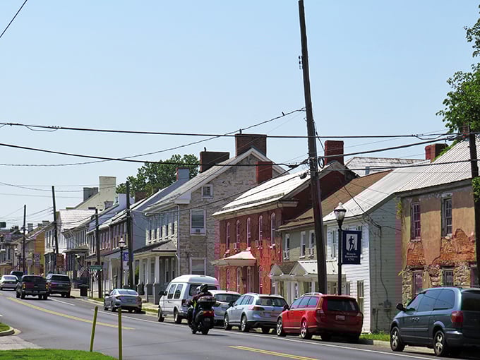 Historic homes line Main Street in a painter's palette of colors, their brick and stone facades telling stories that predate Instagram by centuries.