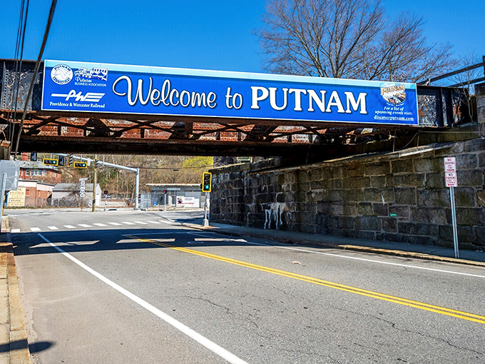 The "Welcome to Putnam" banner spanning the railway bridge announces you've arrived somewhere that actually cares about first impressions.