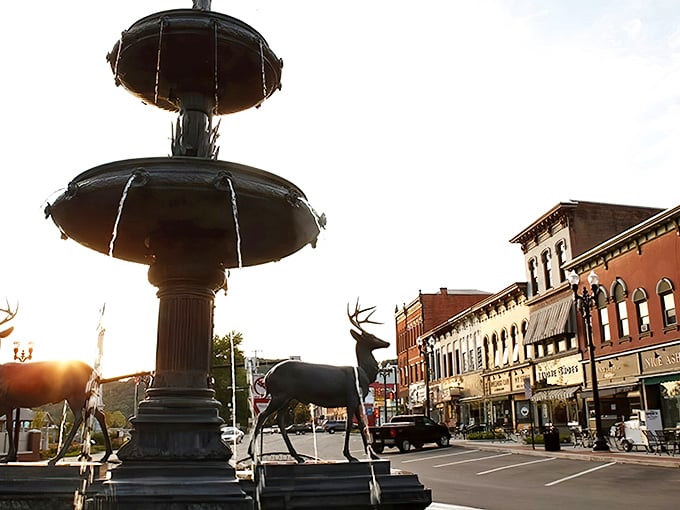 Downtown's fountain and deer sculptures create a postcard-perfect scene at sunset, capturing the essence of a community that values its public spaces.