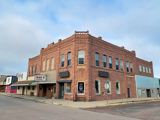 First Savings Bank and Bar-X Coffee occupy this cornerstone building, where financial transactions and caffeine fixes happen daily.