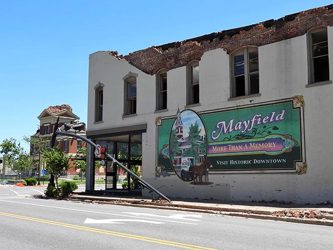 Even tornado damage couldn't erase Mayfield's spirit, as the town's iconic sign stands resilient amid rebuilding efforts.