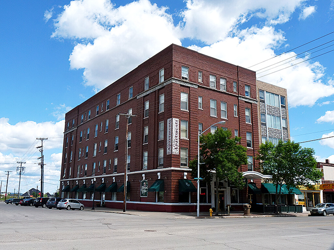 The Ludington Hotel's brick fa&ccedil;ade has weathered decades of Upper Peninsula winters, standing proud as a cornerstone of downtown Escanaba life.
