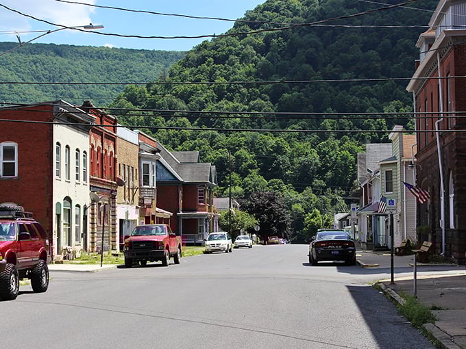 Main Street's colorful buildings tell a century of stories, while mountains cradle the town like protective parents watching over their child.
