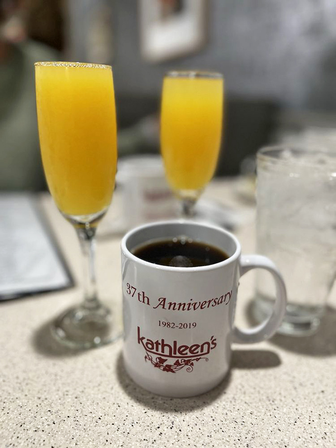 Mimosas and coffee: the dynamic duo of weekend brunching. That anniversary mug suggests they've been perfecting this pairing for decades.