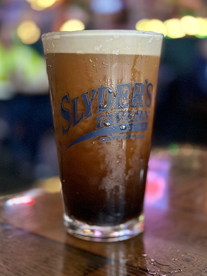 A proper pint with the Slyder's logo—because hydration is important when tackling serious burger business. Beer: making good food great since forever.