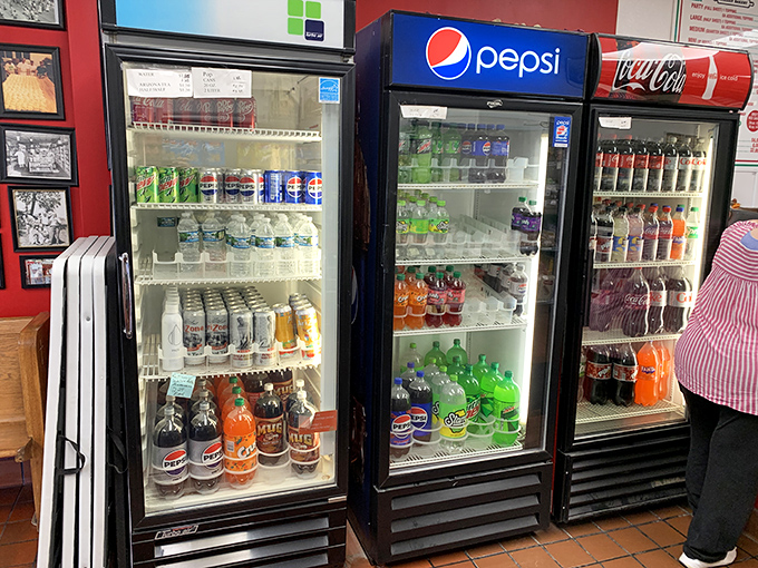 The beverage wall of temptation. Classic sodas stand ready to cut through the richness of all that cheese and dough—the unsung heroes of pizza enjoyment.