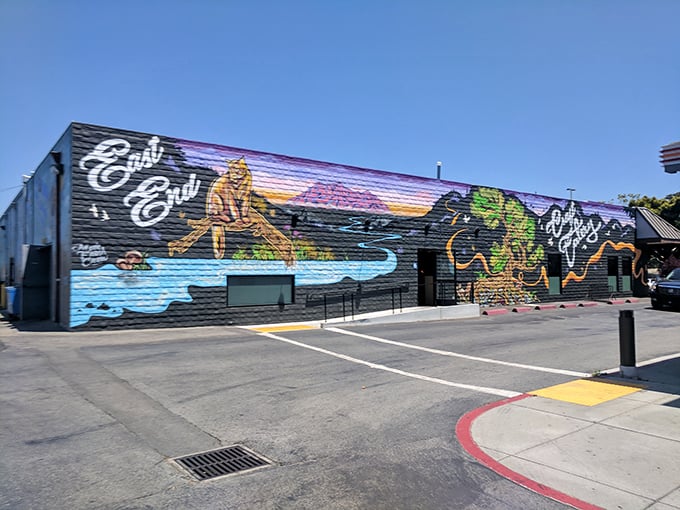 This vibrant mural transforms an ordinary wall into a love letter to California coastal living&mdash;proof that sometimes the best art gallery is just walking down the street.
