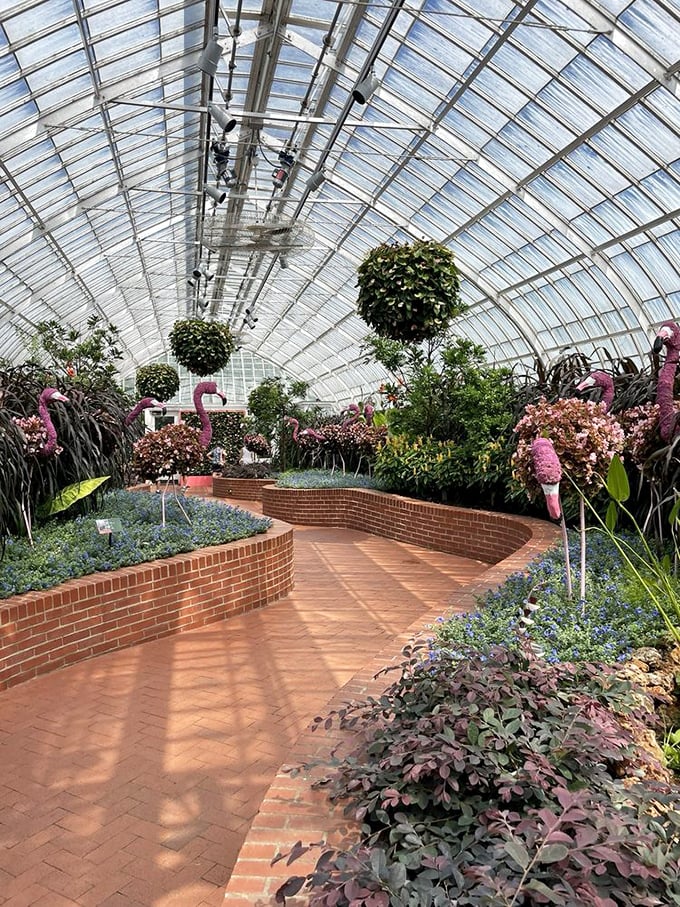 A brick-lined path curves through a wonderland of pink and purple blooms&mdash;the botanical equivalent of following the yellow brick road.