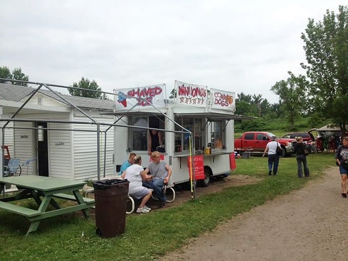 The food stand's hand-painted sign promises Minnesota comfort classics, where the calories don't count if you're burning them walking the market grounds.