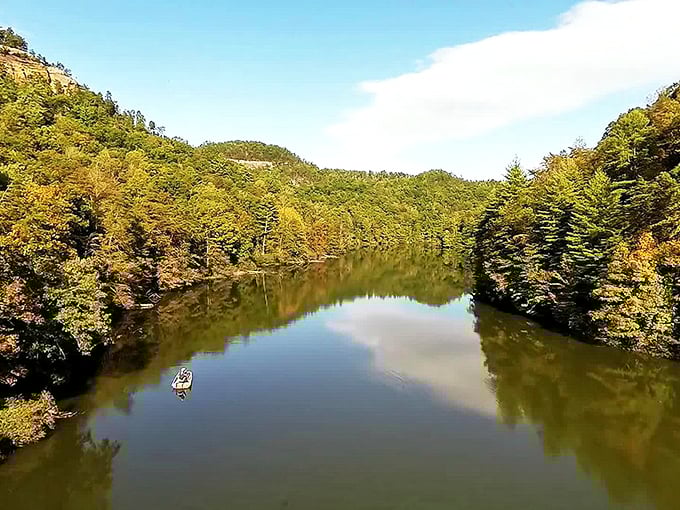Mirror-like waters reflect autumn's palette, creating the kind of double feature that makes smartphone photographers feel like Ansel Adams on vacation. 