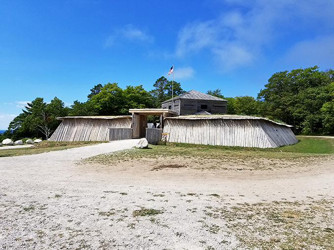 Fort Holmes' rustic wooden palisade stands as a reminder of the island's strategic military importance during the War of 1812.