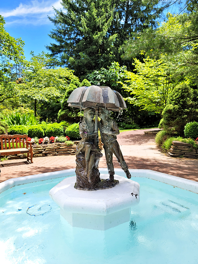 Two figures forever sheltered under an umbrella&mdash;a bronze reminder that some of life's best moments happen when plans get rained on.