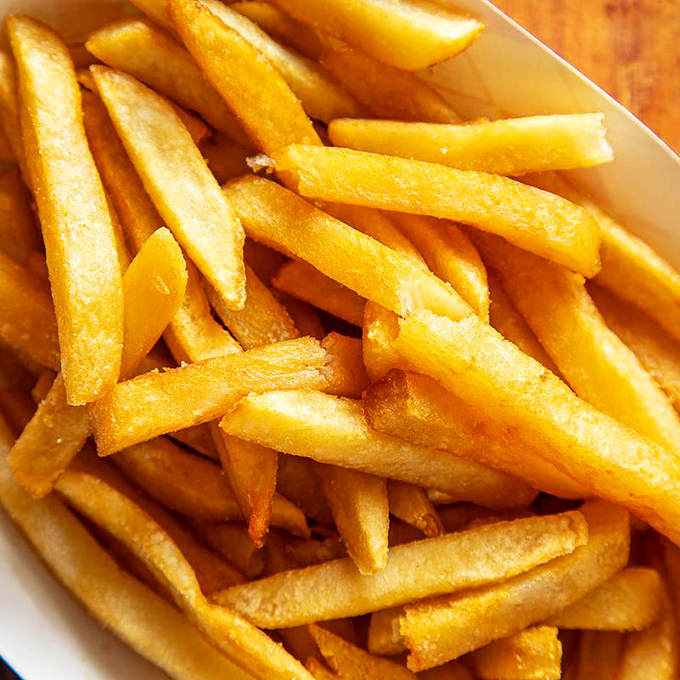 French fries that understand their supporting role&mdash;crispy enough to stand alone but humble enough to complement the star chicken.