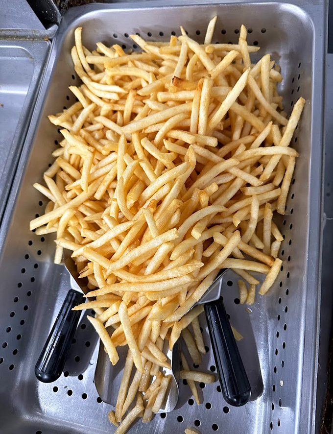 These aren't just fries; they're golden batons of joy, fresh from the fryer and ready for their close-up.