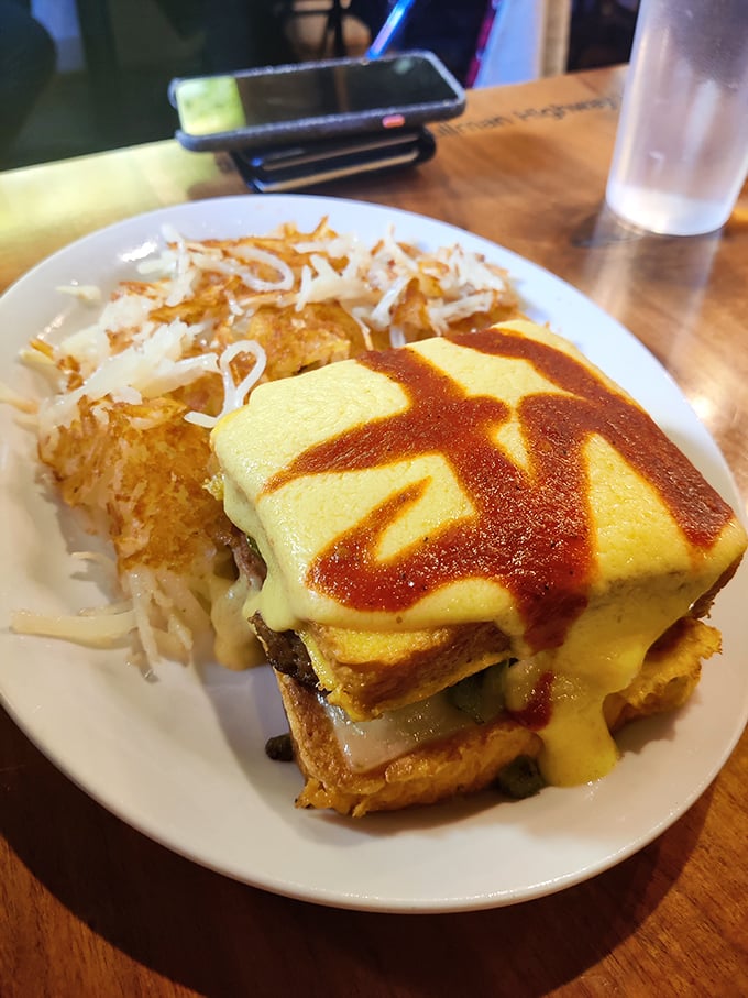 The French Toast Benny breaks all the rules in the best possible way. Sweet meets savory in a breakfast rebellion that would make Julia Child high-five a short-order cook.